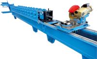 China 12 Stations Fly Saw Cutting Shutter Door Roll Forming Machine Shutter Door Edge Covering for sale
