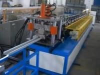 China 1mm Galvanized Coils Stud and Track Roll Forming Machine Chain Transmission for sale
