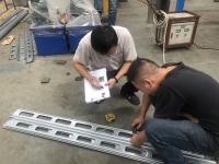 China 0.7-1.2mm Galvanized Perforated Shutter Door Roll Forming Machine with 13 Stations and 5.5Kw Motor for sale