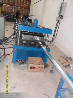 China Shutter Door Roll Forming Machine 7500kg 14 Stations 0.3-0.9mm Thickness PLC Control for sale