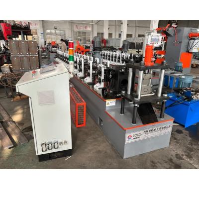 China 1.3-1.5mm Galvanized Steel Roller Shutter Door Rail Roll Forming Machine with Notch 16 Stations 7.5kw for sale