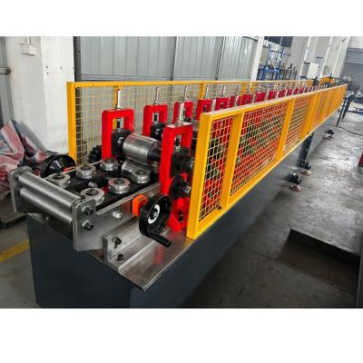 China 0.7-1.2mm Galvanized Steel Shutter Bottom Roll Forming Machine 23 Stations Stop Saw Cutting for sale