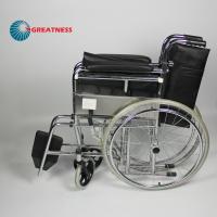 China Folding Steel Wheelchair with Detachable Footrest Flip Back Seat 24 Inch Solid Rear Wheel for sale