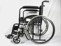 China Powder Coating Folding Steel Wheelchair With Solid Wheel for sale