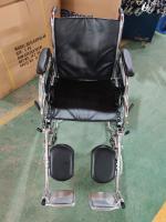 China Folding Transport Wheelchair 100kg Capacity Steel Frame Detachable Desk Armrest Elevating Footrest for sale