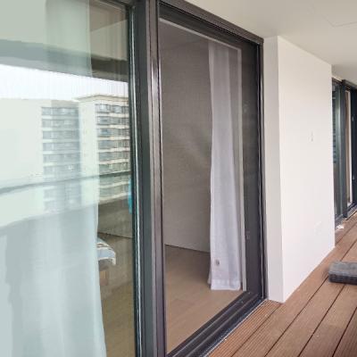 China Glass Fiber Gray Net Trackless Retractable Fiberglass Screen Door for sale