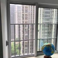 China 1.4mm Aluminum Alloy Frame Retractable Bi Fold Door Retractable Fly Screen Door for sale