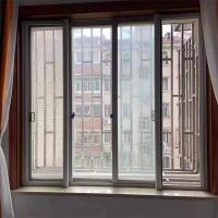 China Pet Proof Fiberglass Gray Mesh Retractable Screen Window Door for sale