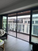China Aluminum Alloy Fly Screen Door Retractable Roller Screen Door Fiberglass Insect Door Customized for sale