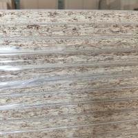 China 18mm PET OSB Laminated Flake Board 1220x2440mm Moisture Resistant Panel for Furniture and Cabinets for sale