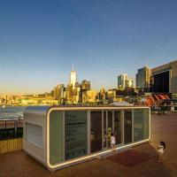 China SHANEOK E70 Luxury Prefabricated Apple Cabin House 11.5m x 2.15m Insulated Tempered Glass Room for sale