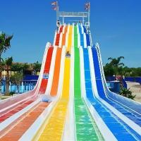 China Commercial Rainbow Water Slide 5-20m Height Fiberglass Thrill Ride with Inflation Mat 240pph for sale