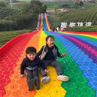 China Commercial Large Rainbow Dry Slide Land Slide Wheeled Slider Block  Expansion Ride Campsites rainbow slide on the hill for sale