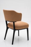 China Luxury Fabric Upholstered Chair with Sculptural Black Frame for Modern Living Spaces for sale