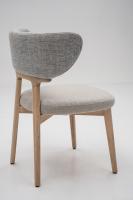 China Modern Solid Wood Dining Chair with Textured Fabric Upholstery for Luxury Dining Spaces for sale