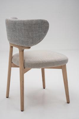 China Modern Solid Wood Dining Chair with Textured Fabric Upholstery for Luxury Dining Spaces for sale