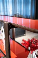 China Modern Dark Wood Open Display Shelf with Red Glossy Shelves, Multi‑Tier Freestanding Storage Rack for Living Room & Hotel Lobby for sale