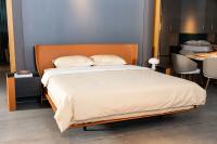China Italian Minimalist Full Leather Upholstered Bed, Orange Genuine Leather Bed Frame for Master Bedroom for sale