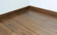 China Anti Scratch Flexible Wooden Color PVC Skirting Line For Low Maintenance Protection for sale