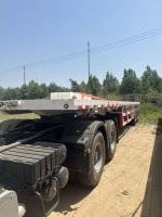 China Zambia Tri Axles 60 Tons Flatbed Semi-Trailer for 20/40 Foot FT Container Shipping for sale