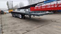 China 20ft 40ft Tri Four Axle 13.5 Meter Flatbed Container Semi-Trailer for Africa Country for sale