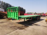 China High Payload 40-60ft 3 Axle Flatbed Semi Trailer for Tanzania Container Shipping for sale