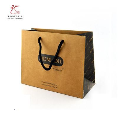 China Custom Kraft Paper Gift Bags 210gsm Printed Shopping Bags for Clothes Packaging for sale
