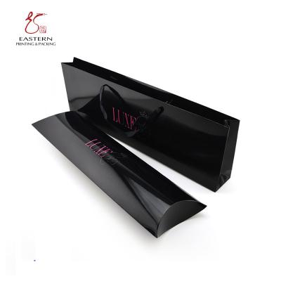 China Custom Hair Packaging Paper Gift Bags with Handles 4 Color Offset Printing Eco Friendly for sale