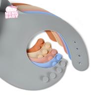 China Button Closure Anti Bacterial Food Catching Bib For Toddlers for sale