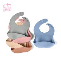 China Baby Unisex Silicone Bib With Food Catcher Multiple Color Choices for sale
