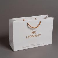China Custom Luxury Gift Garment Paper Shopping Bags With Logo Print for sale