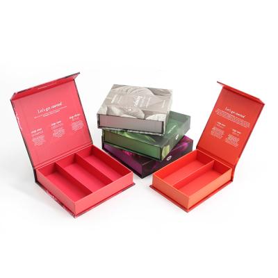 China Custom Premium Paper Magnetic Essential Oil Packaging Gift Box With Divider for sale