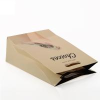 China Custom Printed Paper Bags Gift Packaging With Die Cut Patch Handle for sale