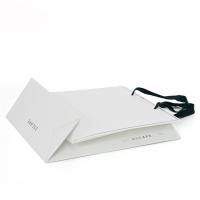China Customized Logo Paper Shopping Bags With Ribbon Handles Full Color Printing for sale