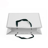 China Customized Logo Paper Shopping Bags With Ribbon Handles Full Color Printing for sale