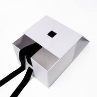China Custom White Magnetic Folding Rigid Boxes With Ribbon For Gift Packaging for sale