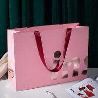 China Custom Printing Branded Logo Retail Paper Shopping Bags With Ribbon Handles for sale