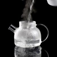China CnGlass Hot Sale Glass Teapot wholesale  600ml Glass Kettle With Warmer Borosilicate Tea Pot Set Glass Pitcher With Bamboo Lid for sale