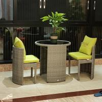 China Rattan Tempered Glass Round Dining Table and Chair Set for Coffee Shop Modern Design for sale