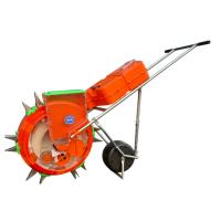China Manual Planter and Fertilizer for Peanut Farm Dual-Chamber Hand Push 14-56cm Plant Spacing for sale