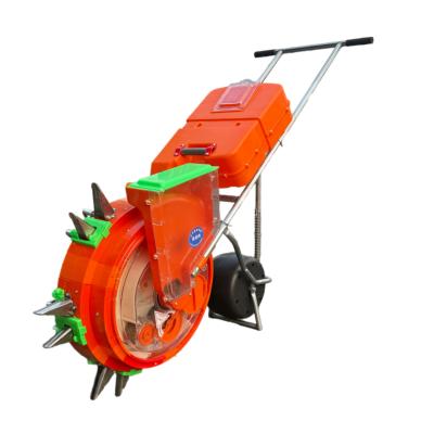 China Manual Fertilizer and Seeding Machine for Corn Farm 2-in-1 Hand Push Tool for sale