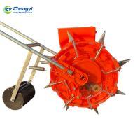 China Steel Manual Seeder Machine Seed Drill 7kg Capacity Adjustable Planting Equipment for sale