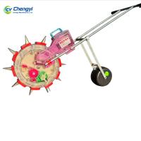 China Heavy Duty Iron Hand Push Seeder Rust Resistant Coating For 4Kg Seed Capacity for sale