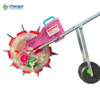 China Farmland Cultivation Hand Push Seeder With Large Diameter Push Wheels for sale