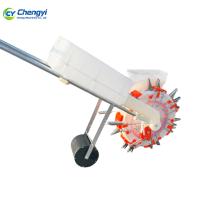 China Eco Friendly Plastic Manual Seeder Machine With Fertilization Lightweight Hand Planter for sale