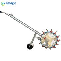 China Iron Manual Seeder Machine 7kg Capacity Hand Push Planter for Precise Sowing for sale