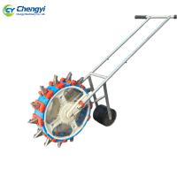 China Iron Manual Seeder Machine 7kg Capacity Hand Push Planter for Precise Sowing for sale
