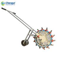China Hand Push Seeder for Precise Sowing with Lightweight Design and Uniform Seed Spacing for sale