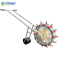 China Stainless Steel Hand Push Seeder 7kg Seed Box Precision Sower for Efficient Garden Planting for sale