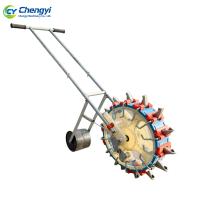 China Polycarbonate Hand Push Seeder 7kg Seed Box Precision Manual Garden Sower Planter Tool for sale